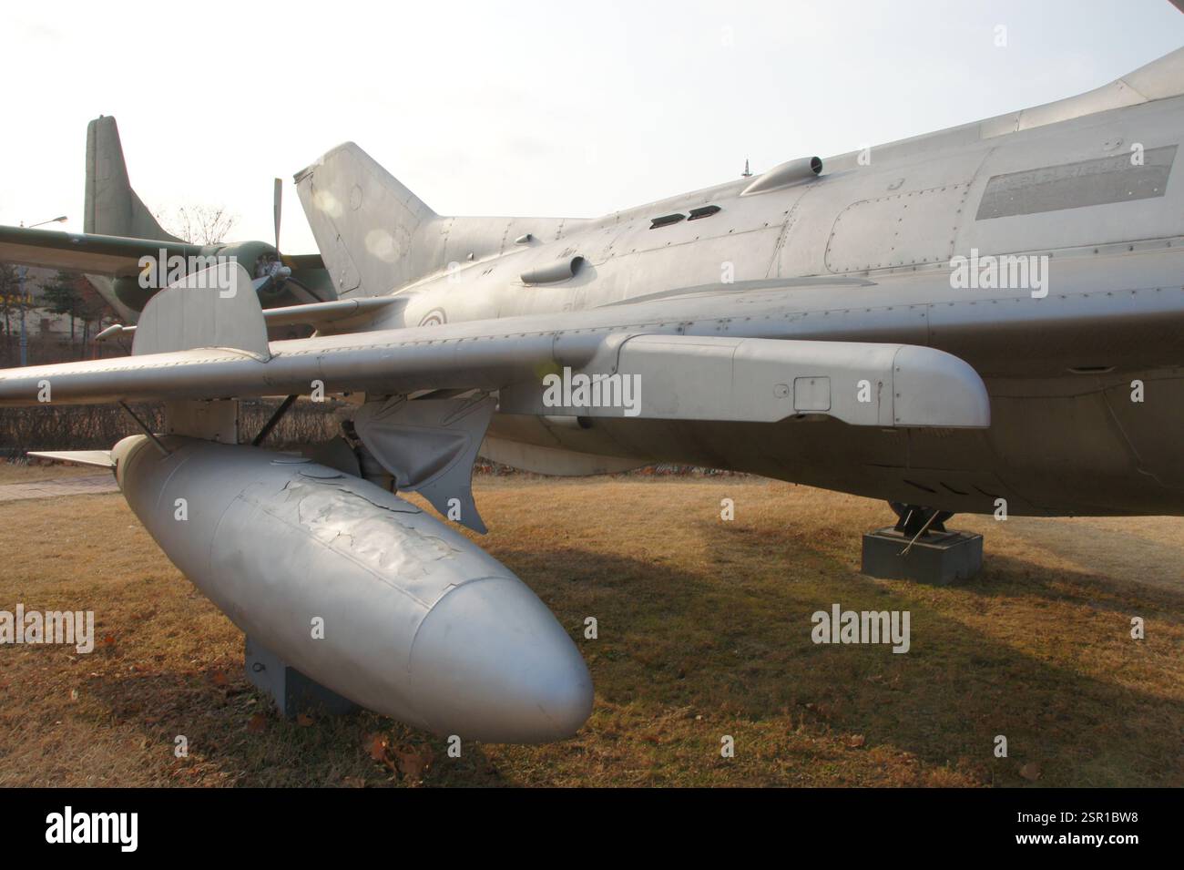 Aircraft rear view, drop tank attached to fuselage, swept wings visible ...