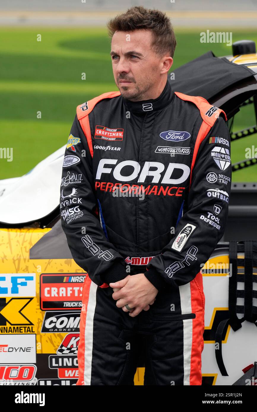 Actor turned race car driver Frankie Muniz leans against his truck ...