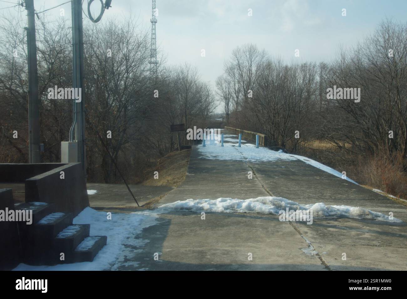 Bridge, snowy concrete surface, barricades ahead. Symbol of division ...