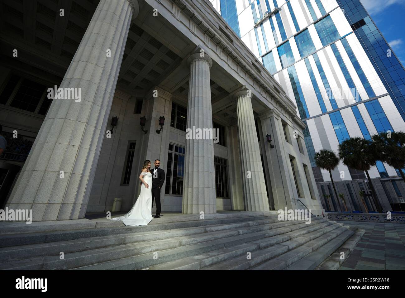 Yaiseli Figueredo, left, and Rider Simoneau pose for pictures on the steps of the Dade County ...
