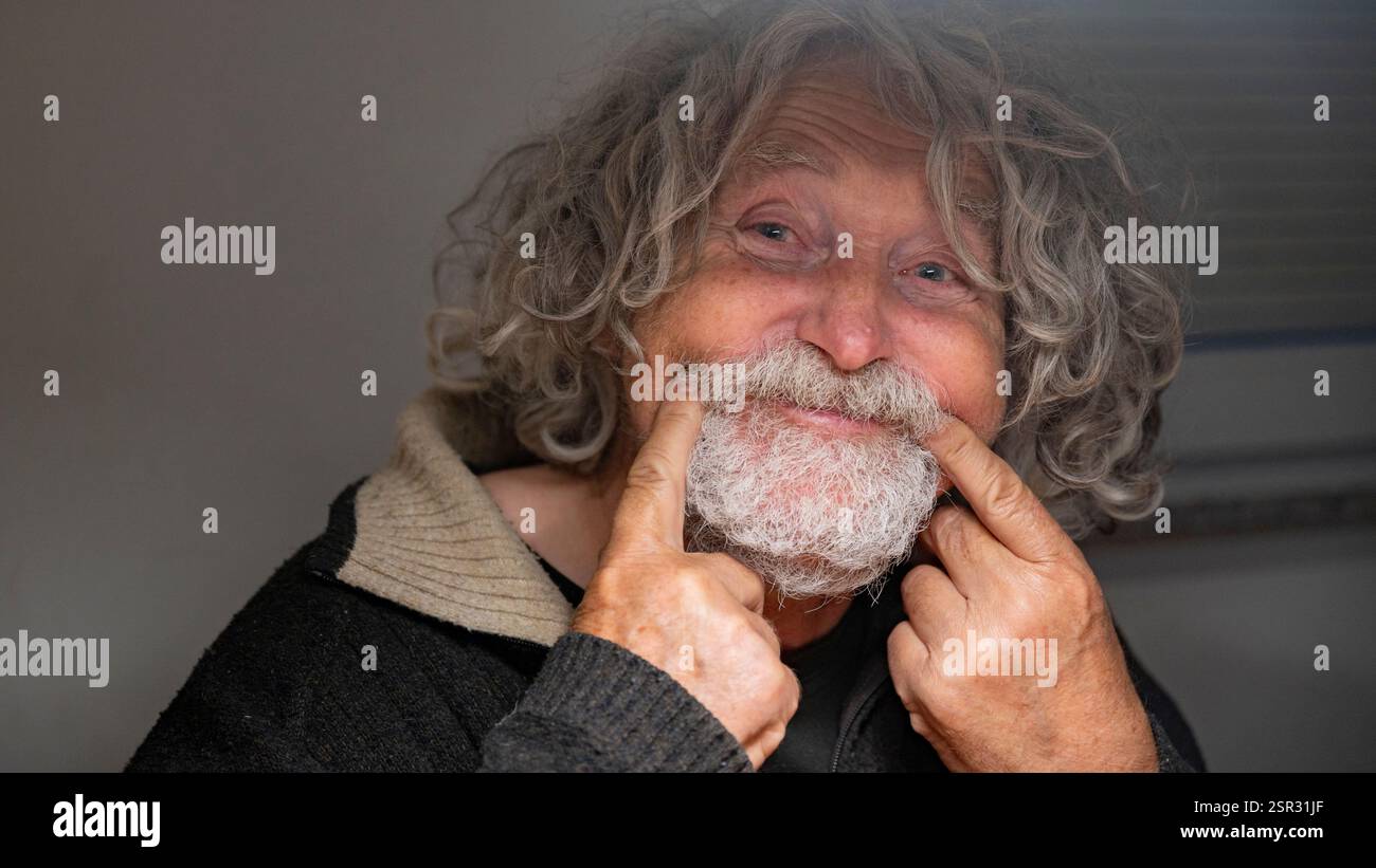 Man curly hair beard points hi-res stock photography and images - Alamy