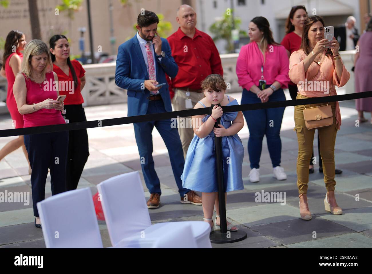 Shalimar Rodriguez, 7, looks on as her mother gets married in a ...