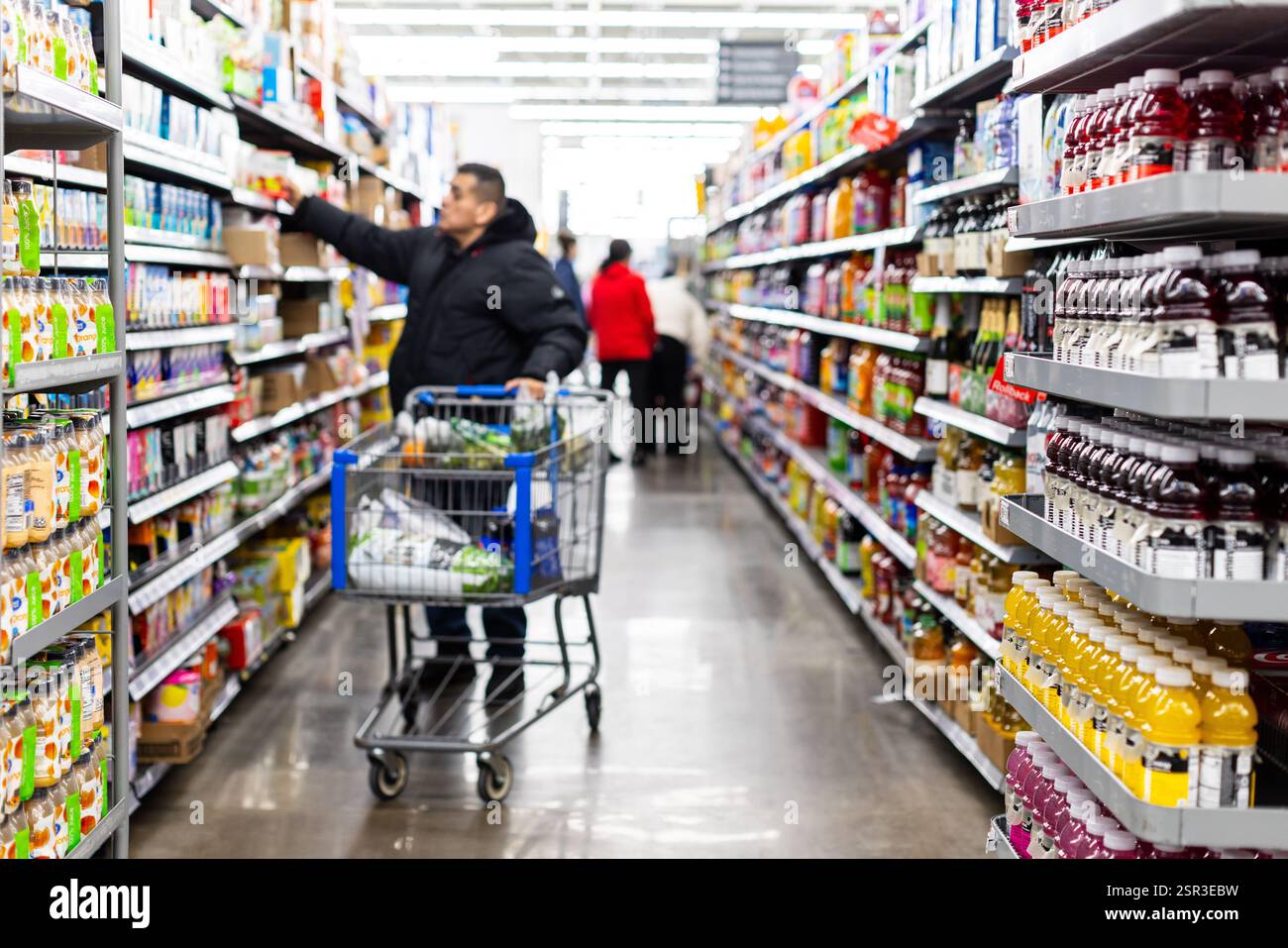 Scranton, PA - February 9, 2025 : Man is pushing a shopping cart in a ...