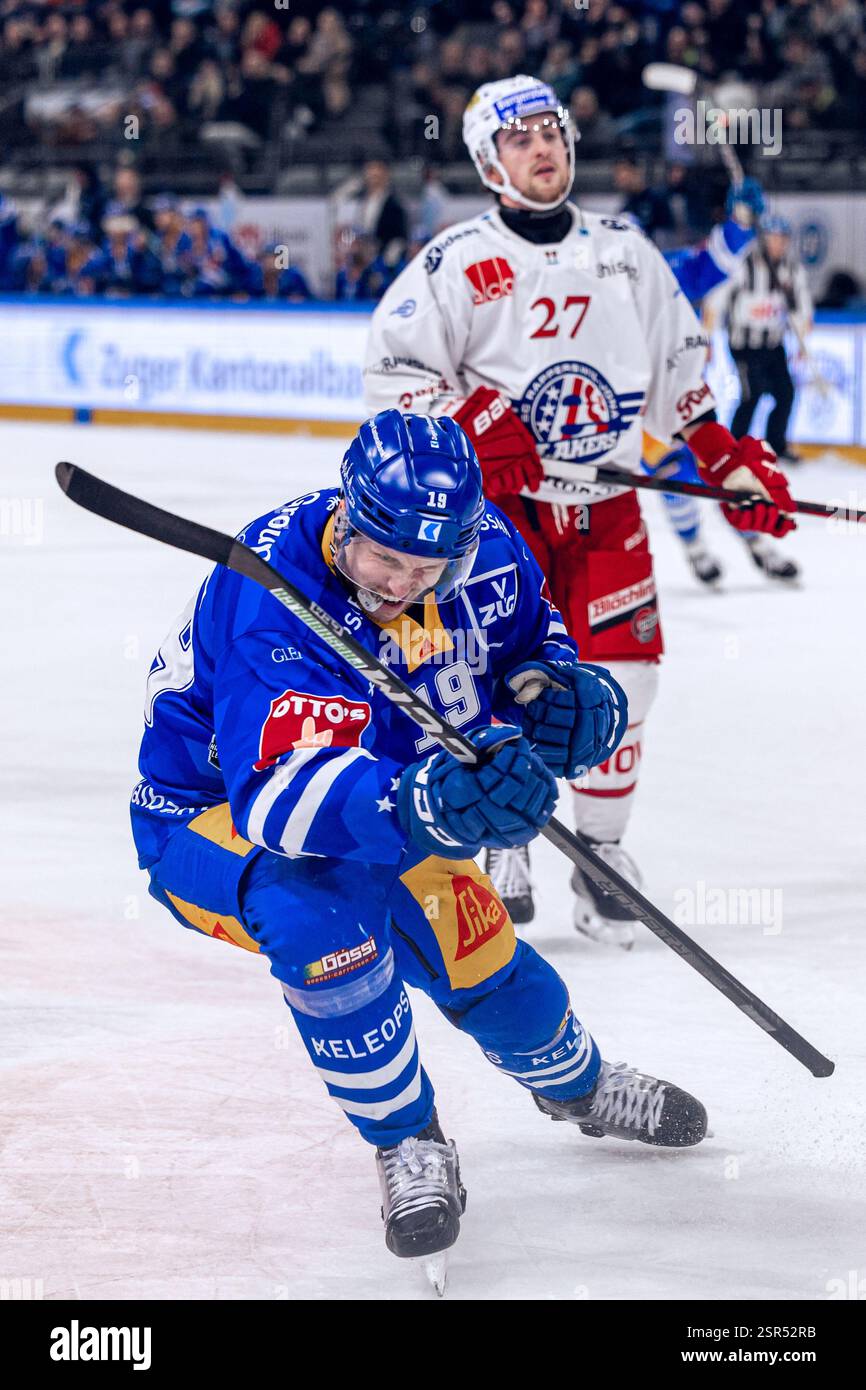 Niklas Hansson #19 (EV Zug) celebrates the 1:1 equaliser and his first ...