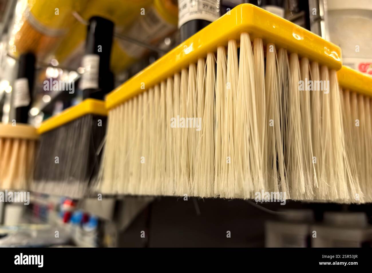 Colorful tools for applying paint hang neatly on store display Stock ...