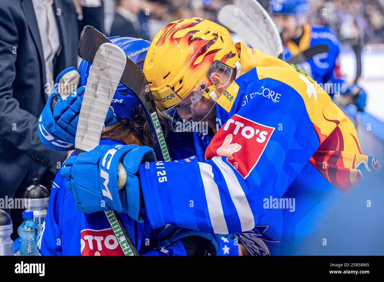 Top scorer Lino Martschini (EV Zug) hugs Daniel Vozenilek #96 (EV Zug ...