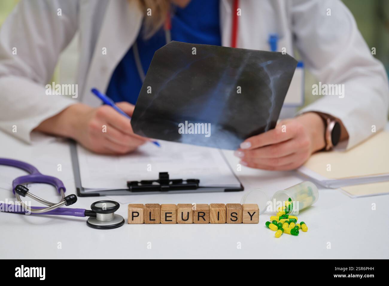 An experienced physician reviews Xray images to assess pleurisy and ...