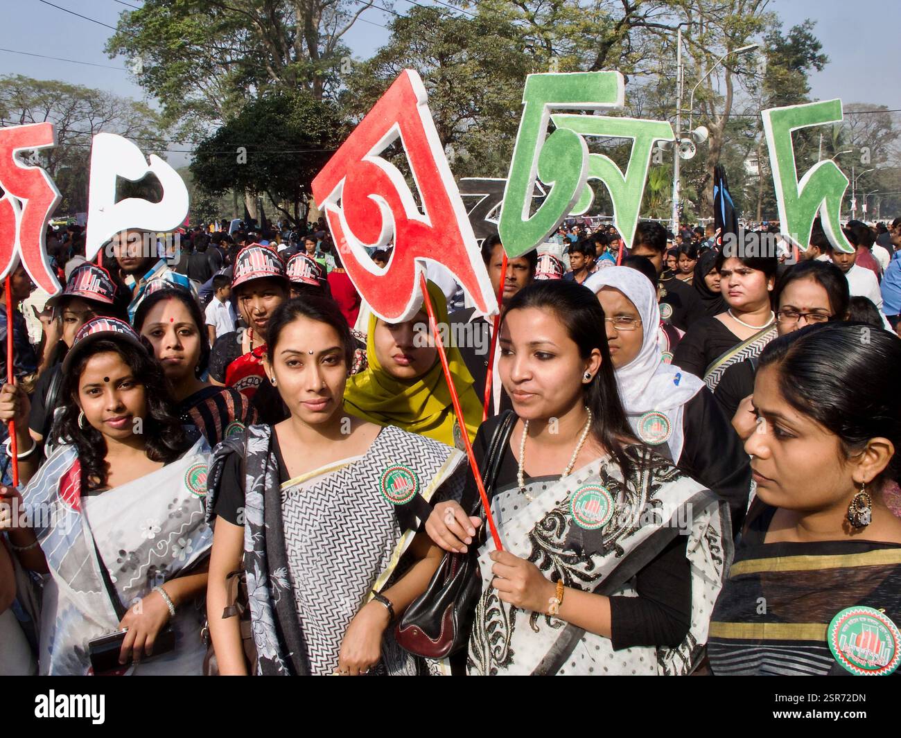 Women march during Ekushey February in Dhaka, Bangladesh, holding ...