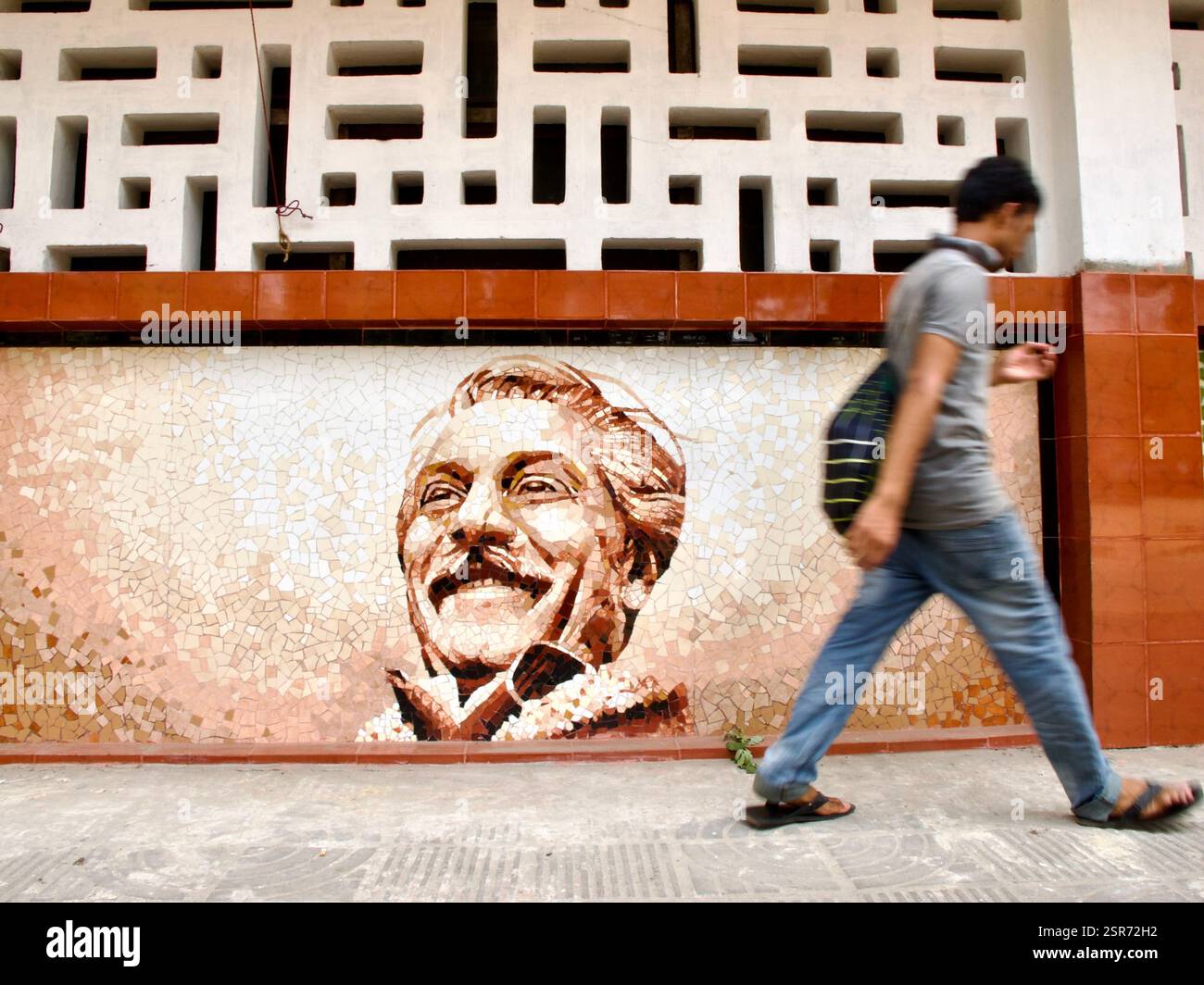 A student walks past a mosaic of Sheikh Mujibur Rahman at the Teacher ...