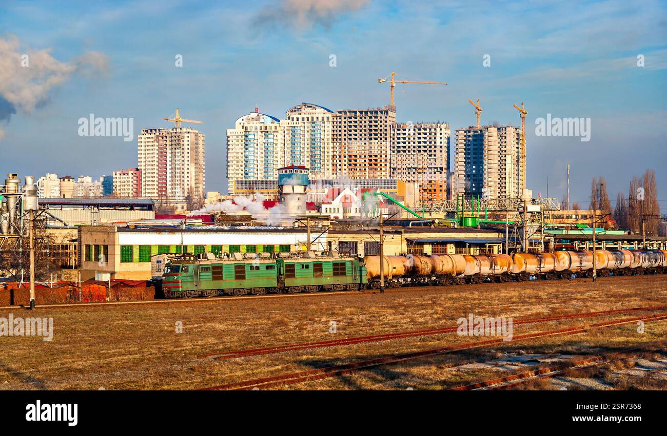 Old Soviet electric locomotive with an oil tanker train at Darnytsia ...