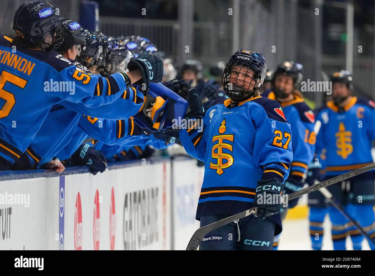 Toronto Sceptres' Emma Maltais (27) is congratulated by her teammates ...