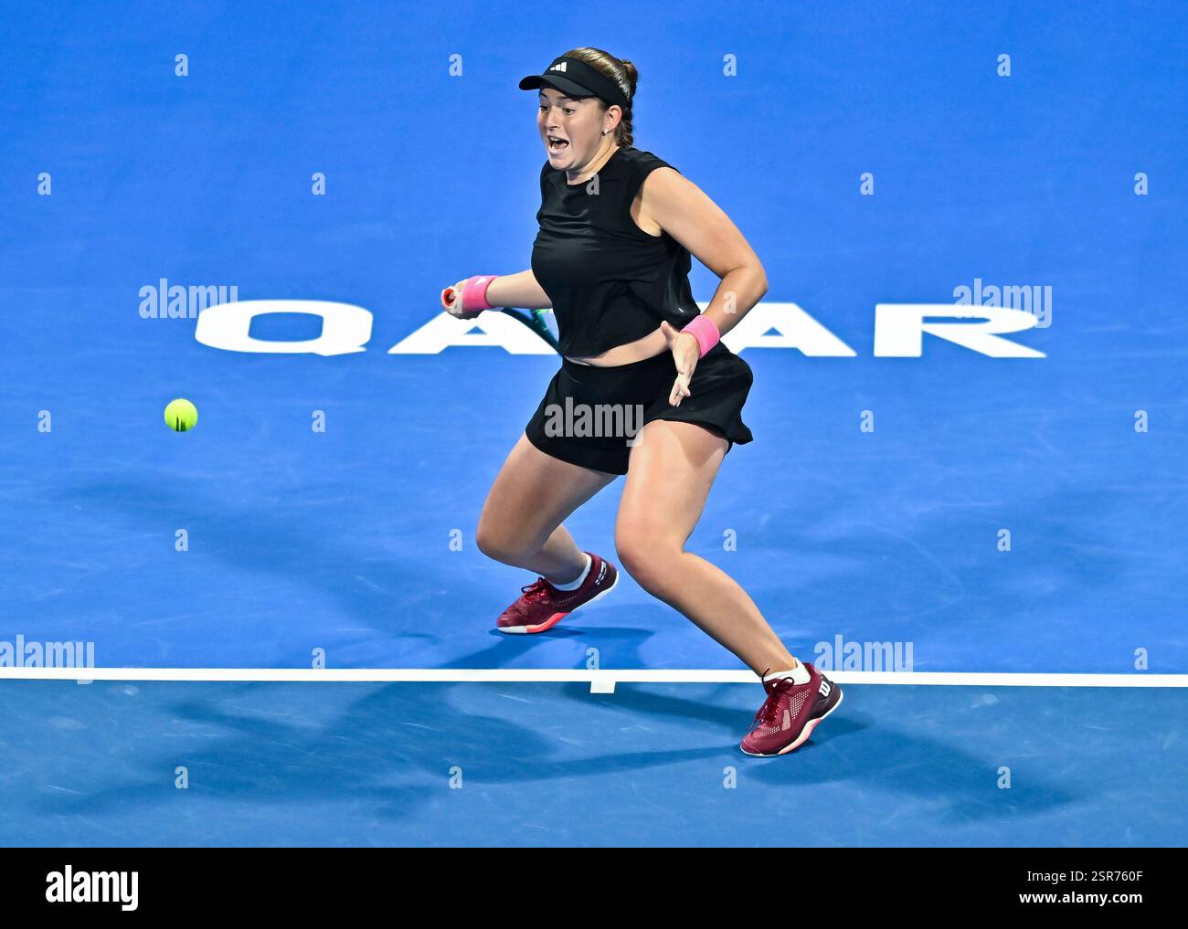 Doha, Qatar. 14th Feb, 2025. Jelena Ostapenko hits a return during the women's singles semi ...