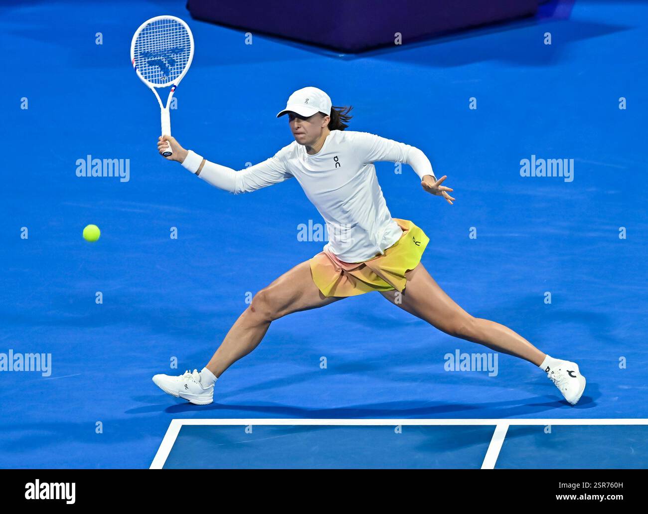 Doha, Qatar. 14th Feb, 2025. Iga Swiatek hits a return during the women's singles semi-final ...