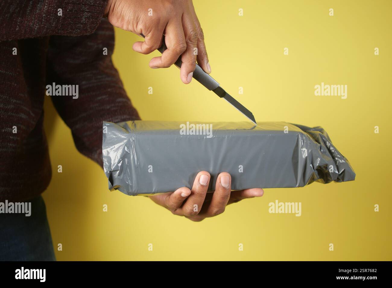 Person cuts open package hi-res stock photography and images - Alamy