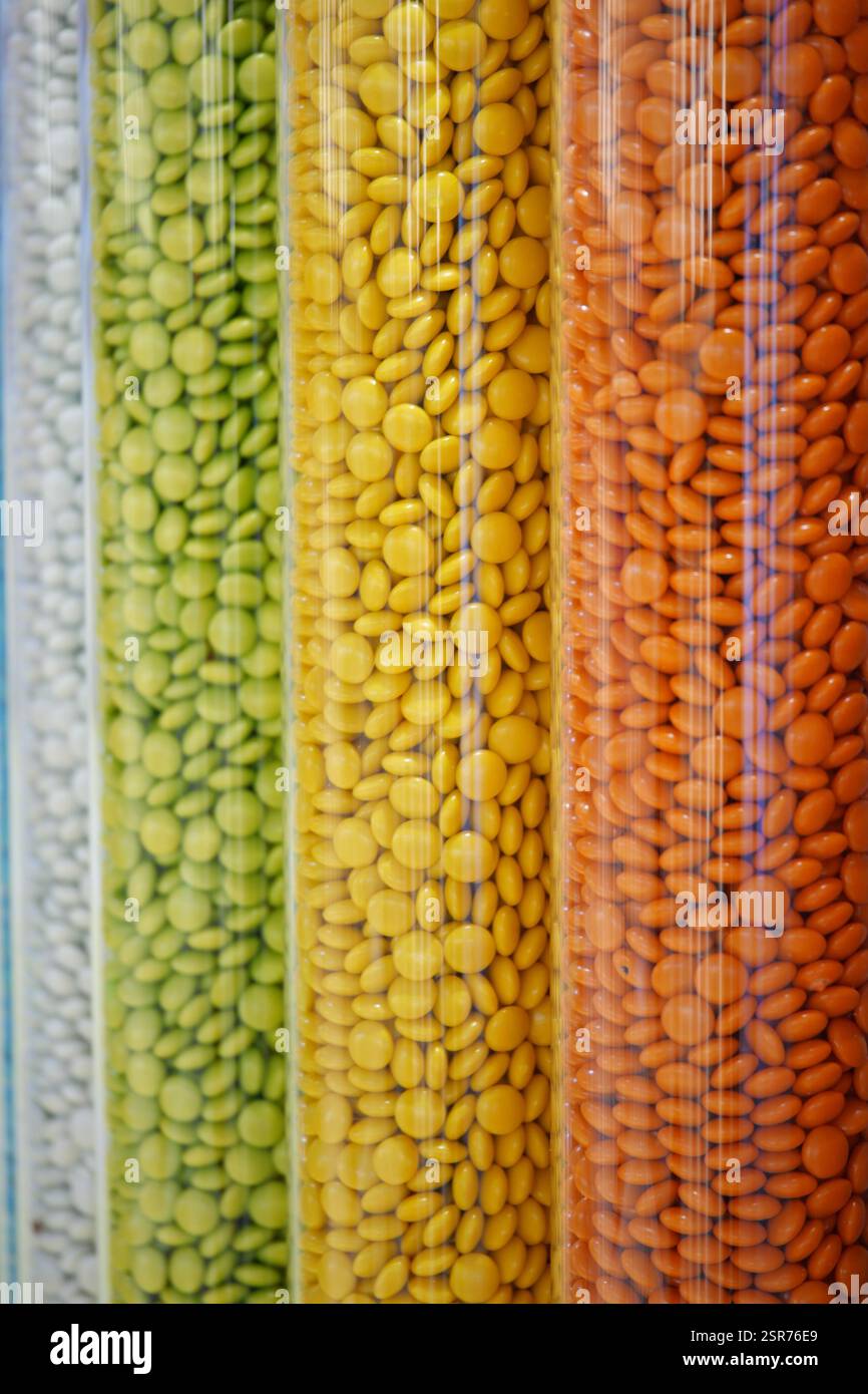 Colorful variety of lentils displayed in transparent containers Stock ...