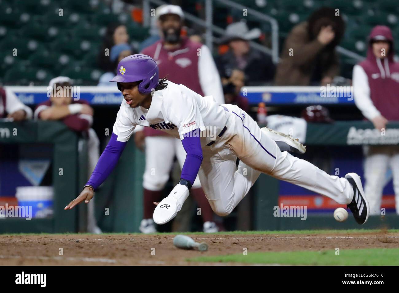 Prairie View A&M runner Michael Burroughs dive for home plate but is ...