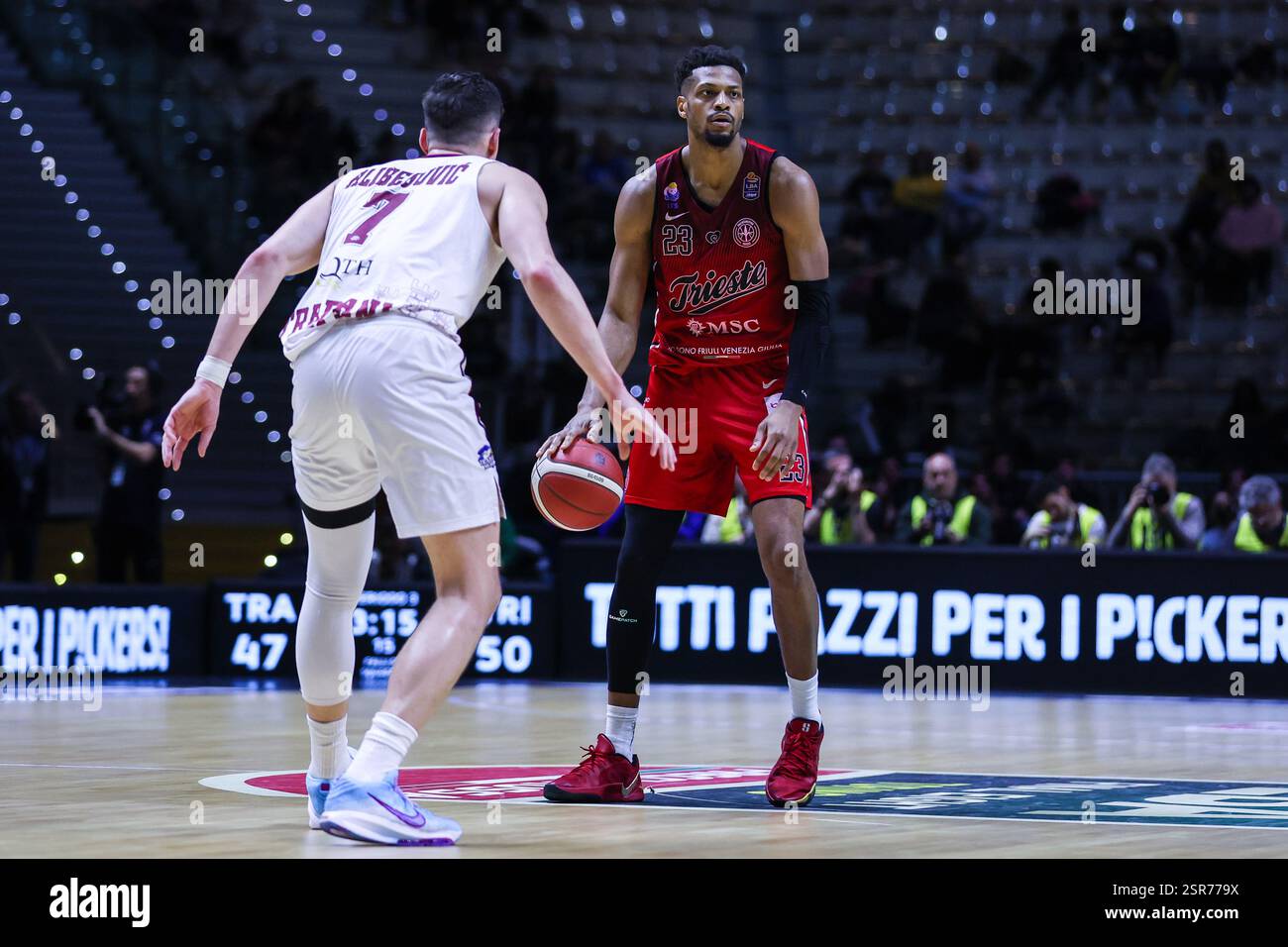 Turin, Italy. 13th Feb, 2025. (R) Jeff Brooks #23 of Pallacanestro ...