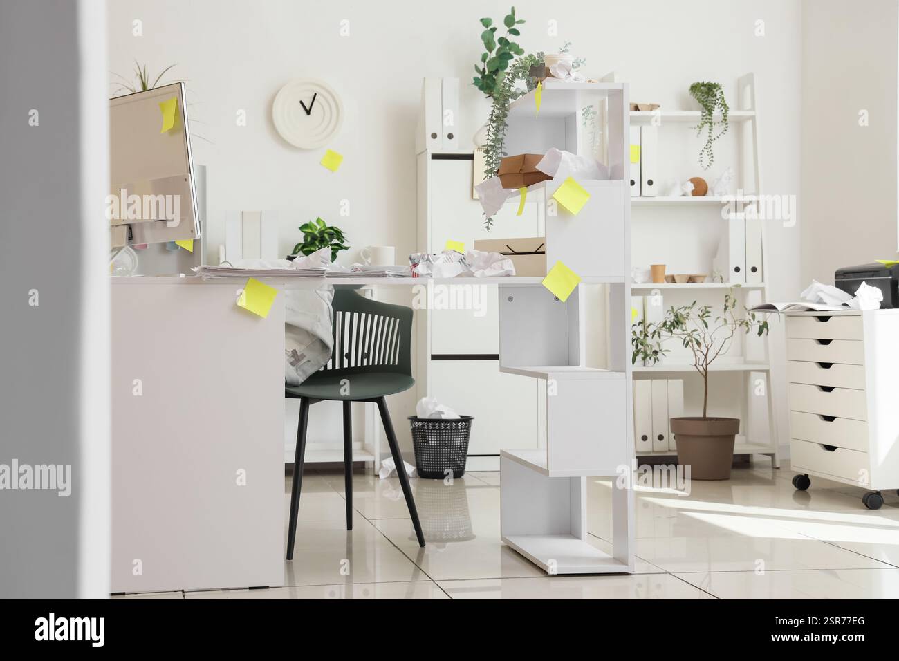 Interior of messy office with workplace, shelf units and sticky notes ...