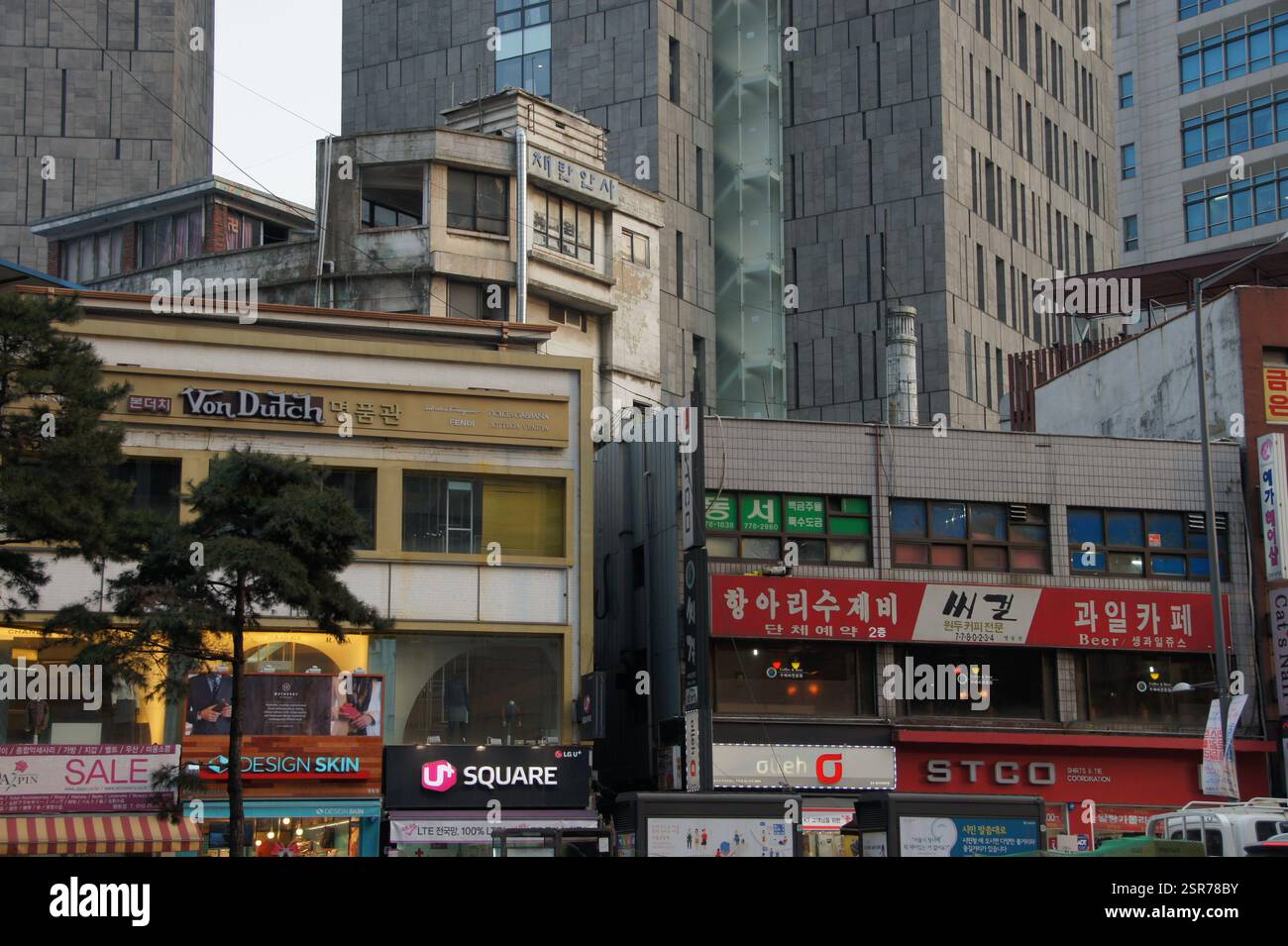Korean street scene with diverse storefronts and architecture. A mix of ...