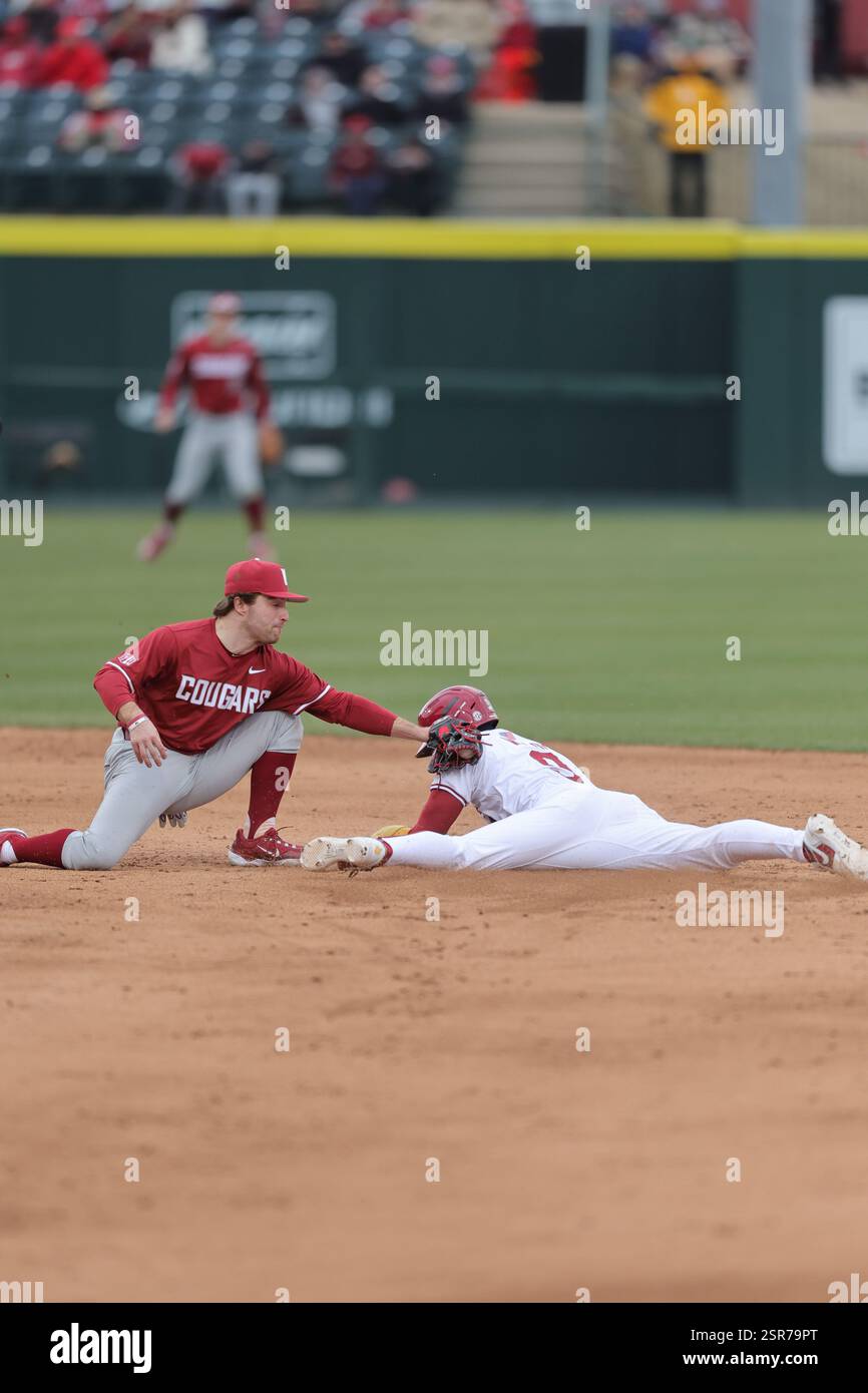 February 14, 2025: Wehiwa Aloy (9) of Arkansas slides safely into third ...