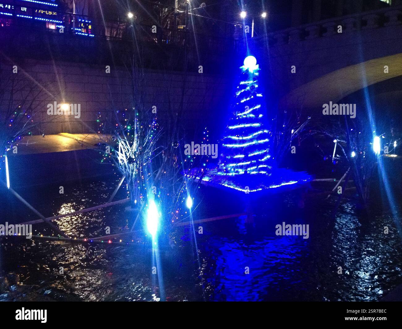 Christmas tree, decorated with lights, floats on a river in South Korea ...