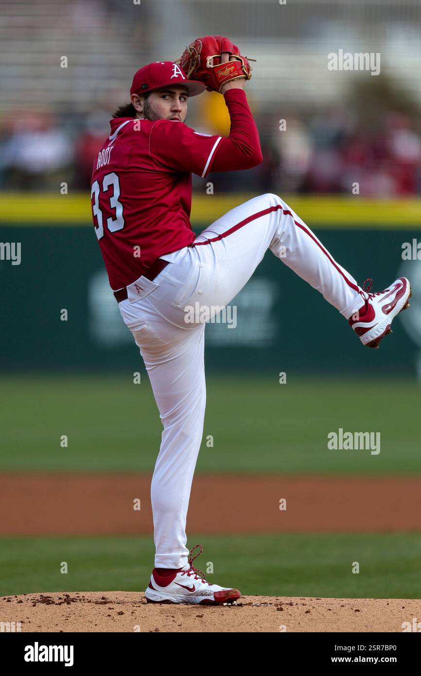 February 14, 2025: Zach Root (33) of Arkansas starts his wind up on the ...