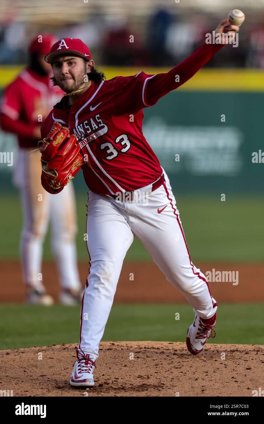 February 14, 2025: Hogs pitcher Zach Root (33) releases the ball off ...