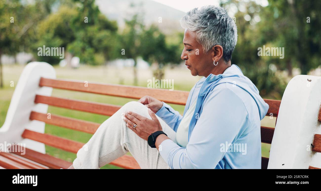 Mature, woman and knee pain with injury on park bench for muscle ...