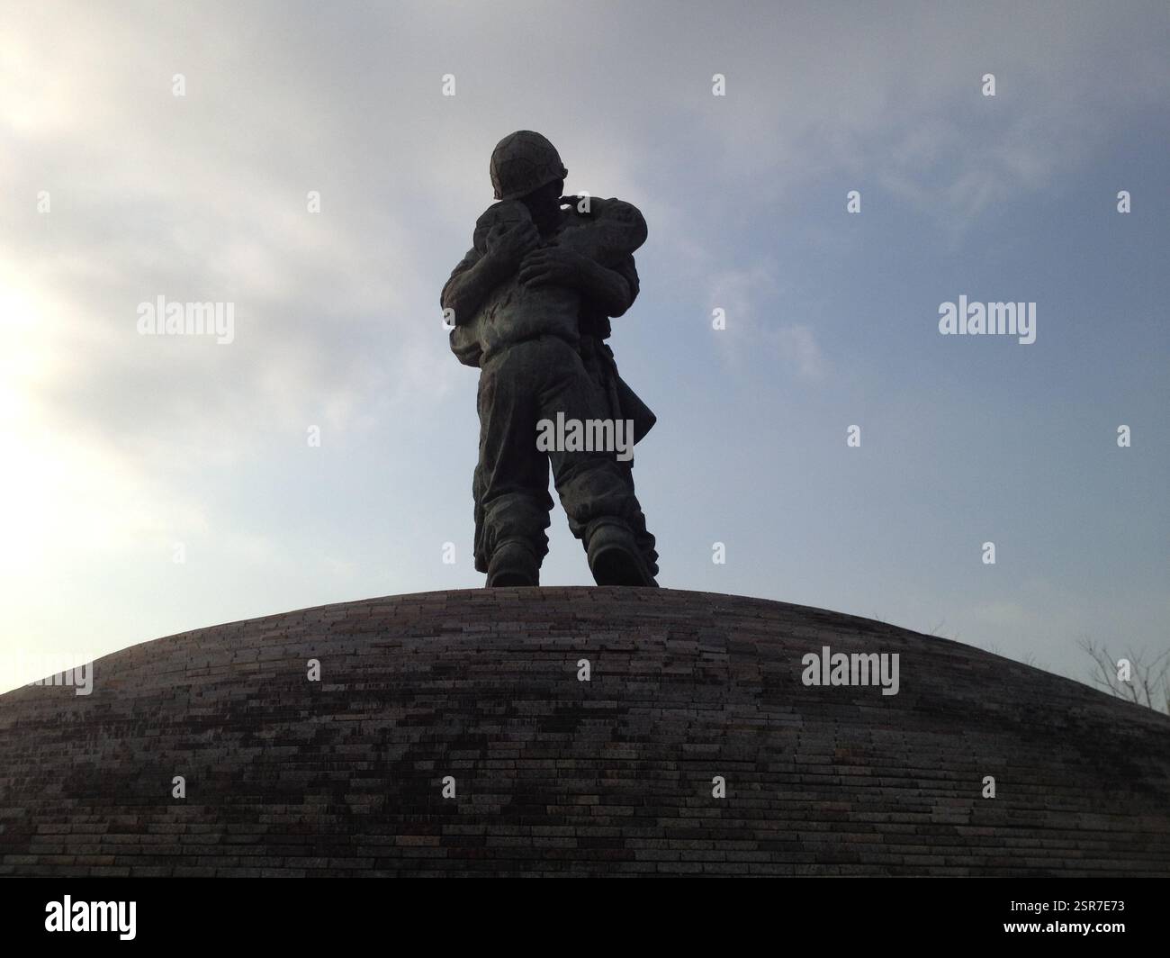 The statue depicts a soldier embracing a child. The statue is a tribute ...
