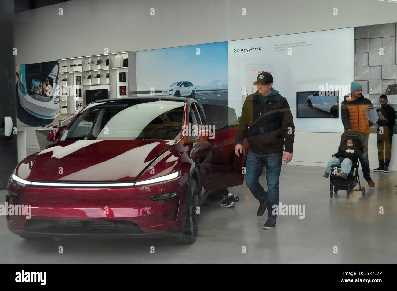 New York, United States. 13th Feb, 2025. Visitors look at Tesla ...