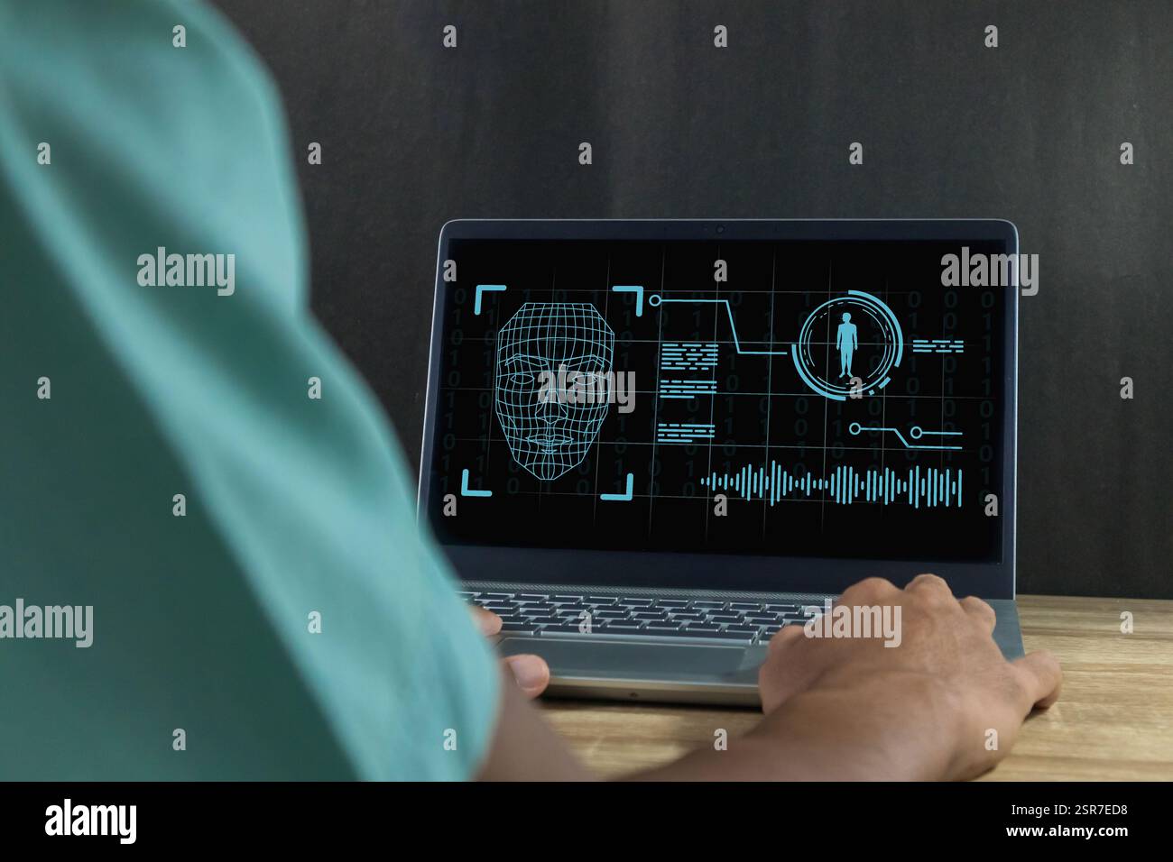 Deepfake and artificial intelligence concept. Man using a laptop to ...