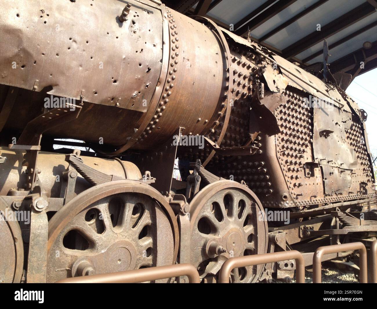 Old steam locomotive, a relic from a bygone era. Rusted metal with ...