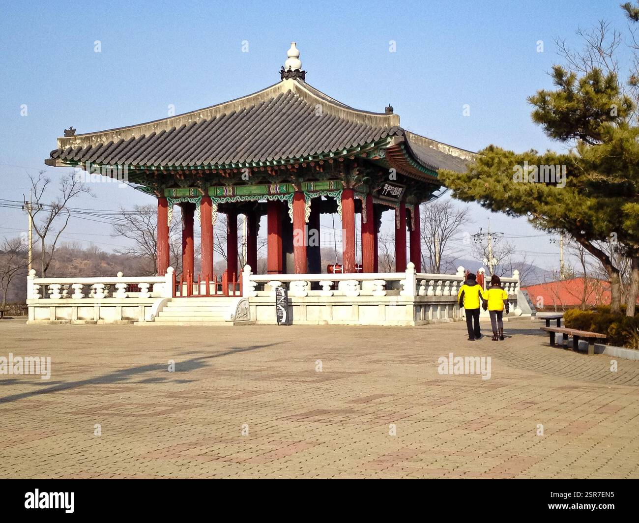 Pyeonghwauijong, the Peace Bell. A bell pavilion with a tiled roof and ...