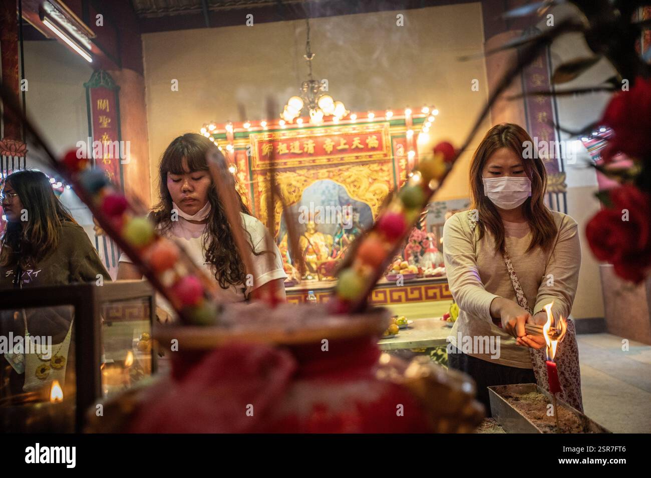 Chiang Mai, Thailand. 28th Jan, 2025. People light up incent in the ...