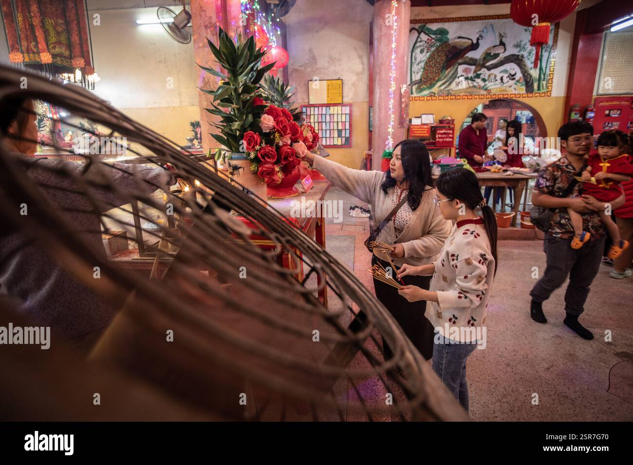 Chiang Mai, Thailand. 28th Jan, 2025. People light up incent in the ...