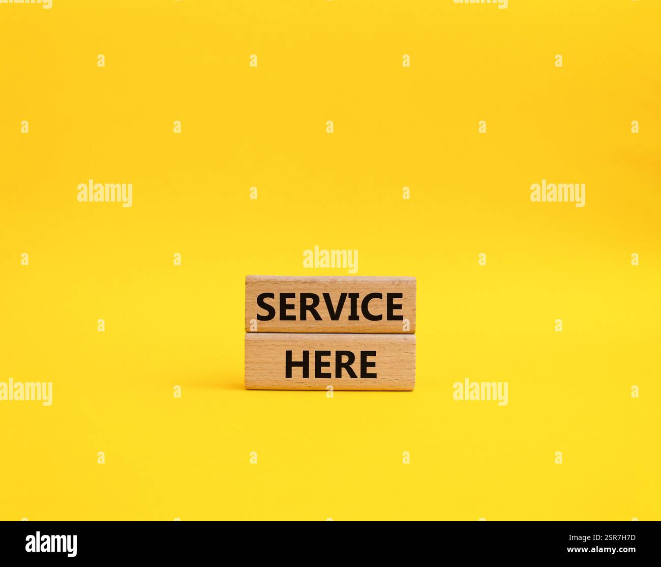 Service here symbol. Concept words Service here on wooden blocks ...