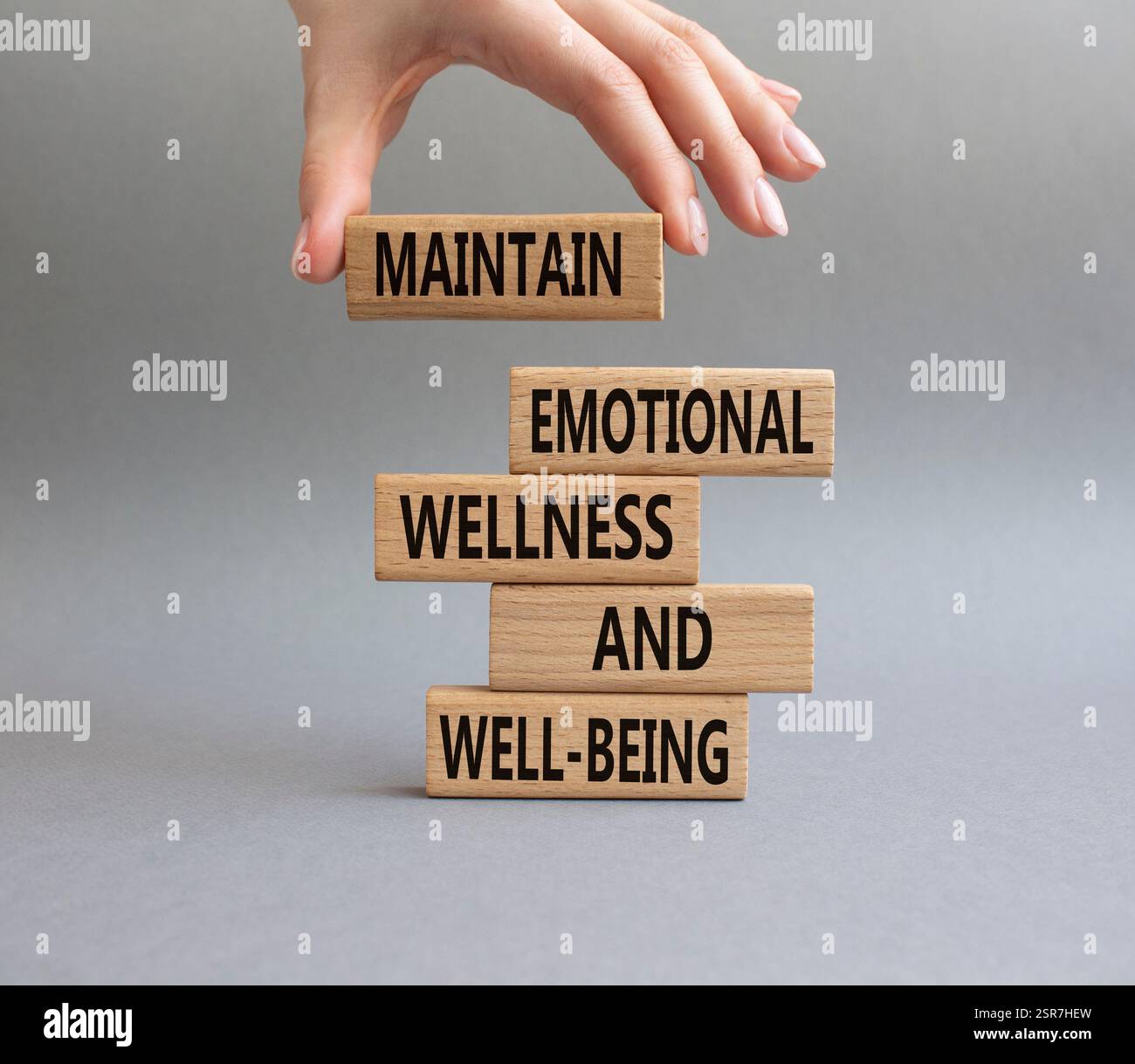 Wellness and Well-being symbol. Wooden blocks with words Maintain ...