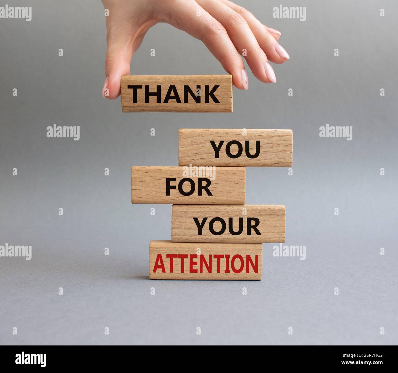 Attention symbol. Wooden blocks with words Thank you for your attention ...