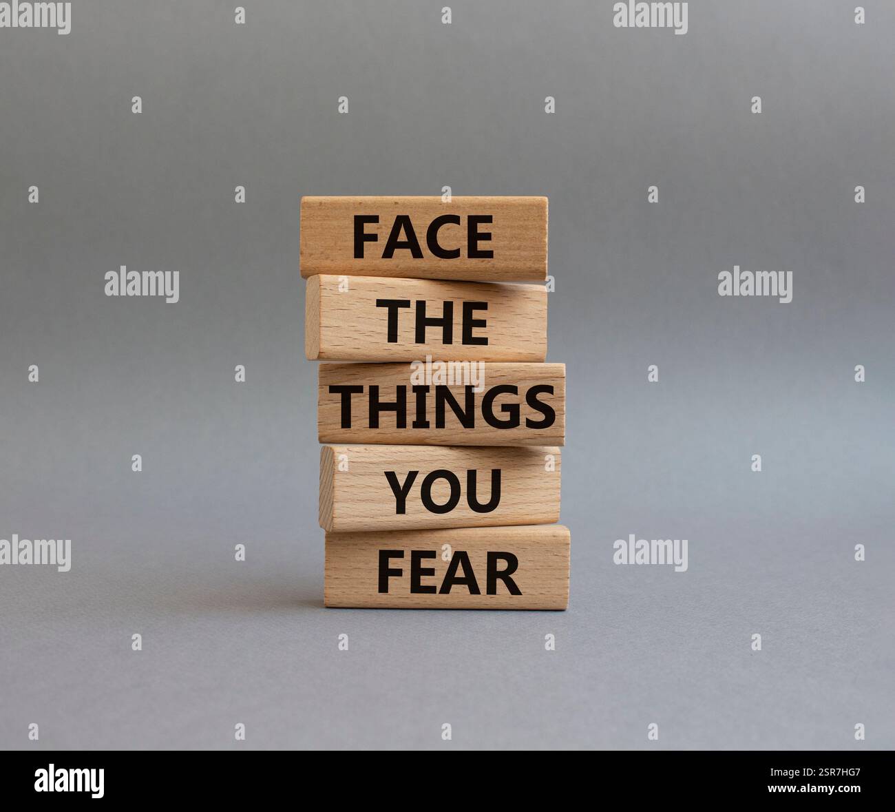 Face the things you fear symbol. Wooden blocks with words Face the ...