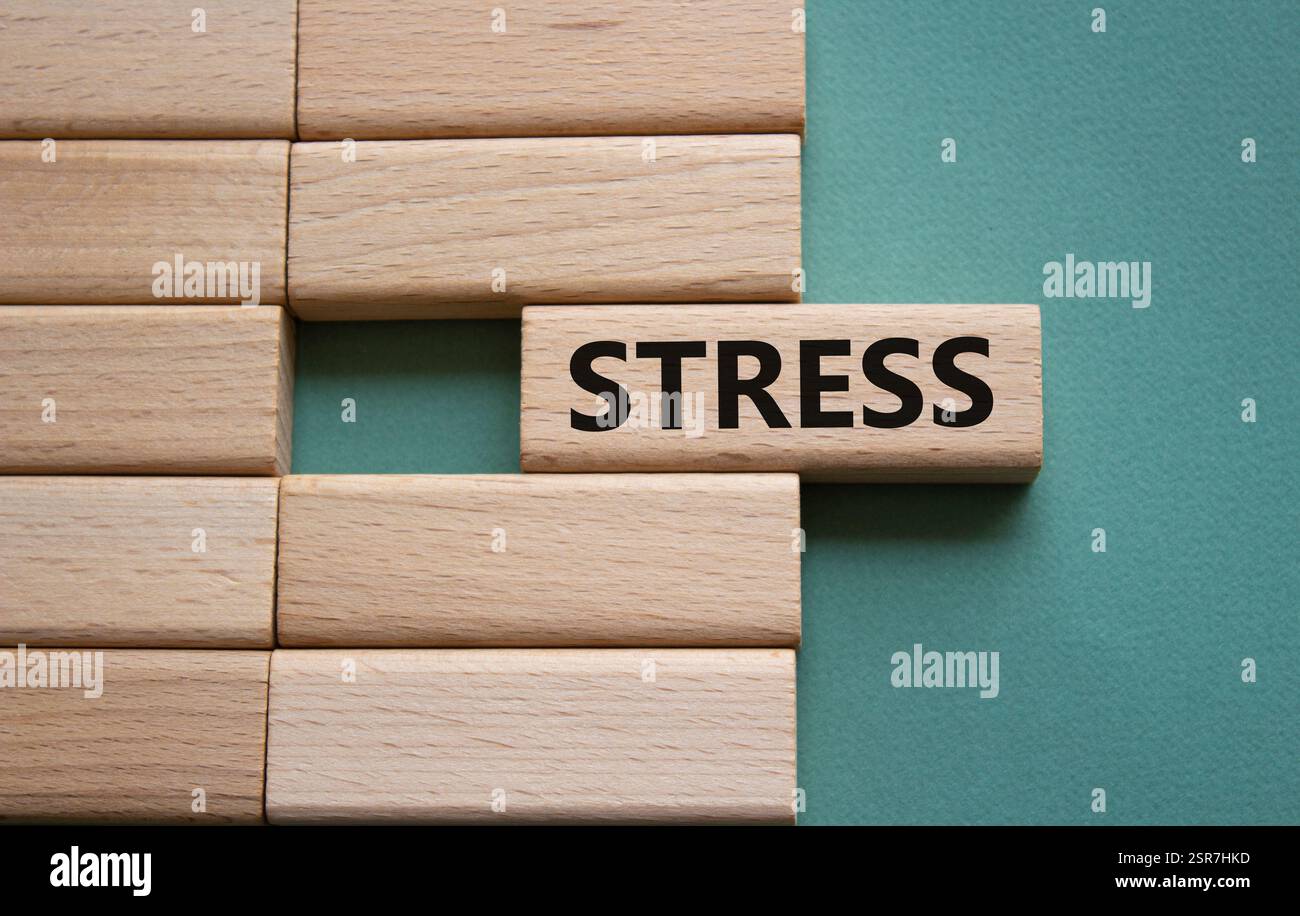Stress symbol. Concept word Stress on wooden blocks. Beautiful grey ...