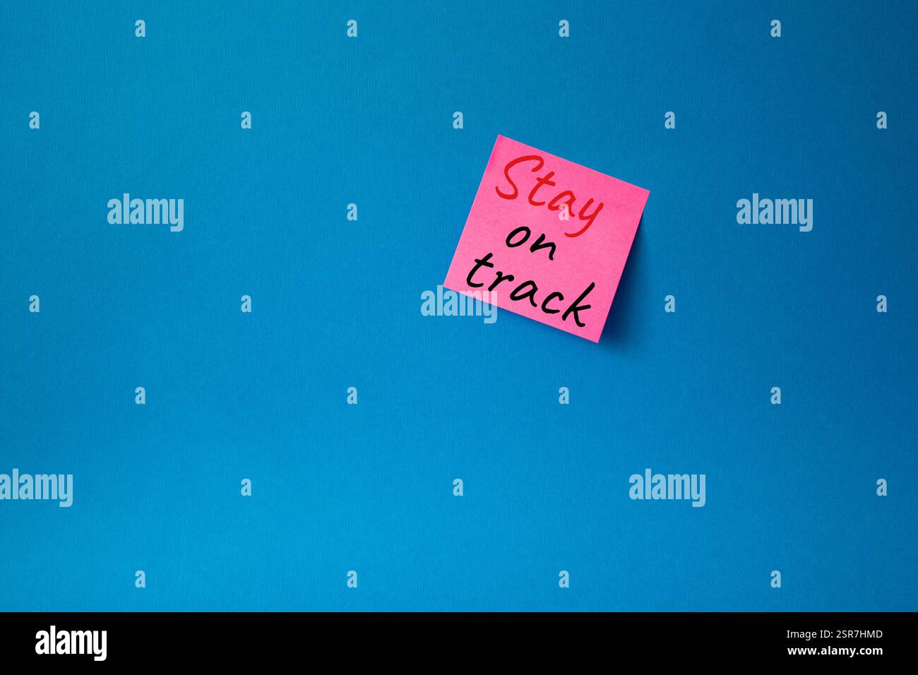 Stay on track symbol. Concept words words Stay on track on pink steaky ...