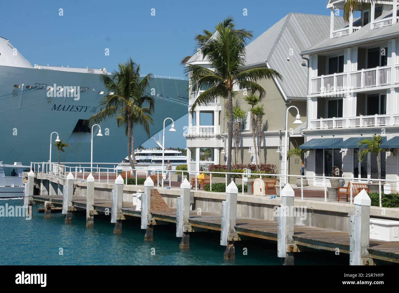 Pier stretches into the calm waters of Key West, its wooden walkway ...