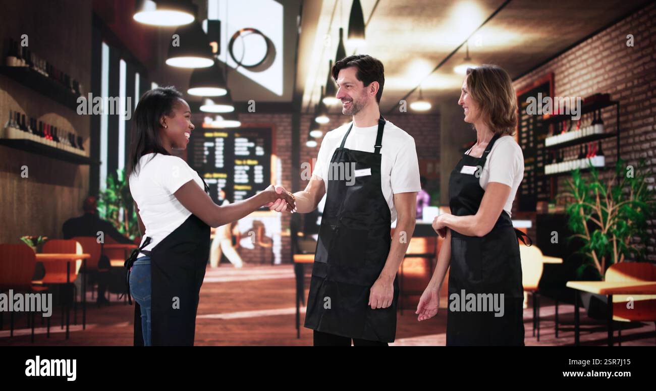 Multiracial team celebrates successful new chef at busy restaurant cafe ...
