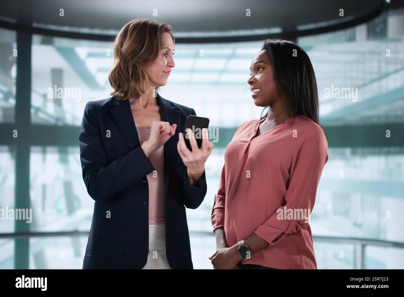 African American woman giving career pitch in elevator conversation ...