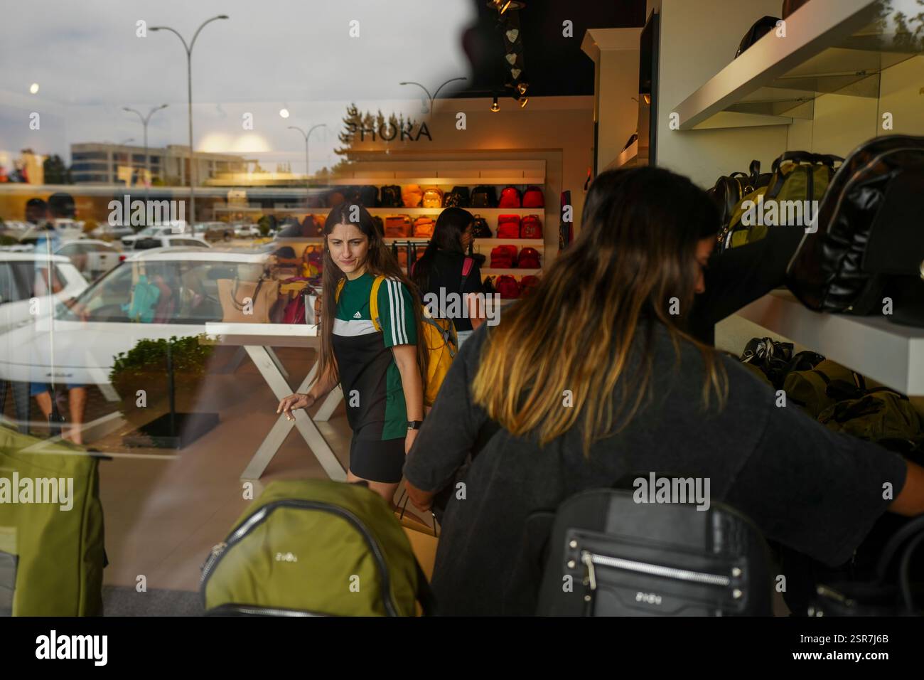 Argentine tourist Ana Laura Termini shops with friends at a mall in the seaside town of Renaca ...