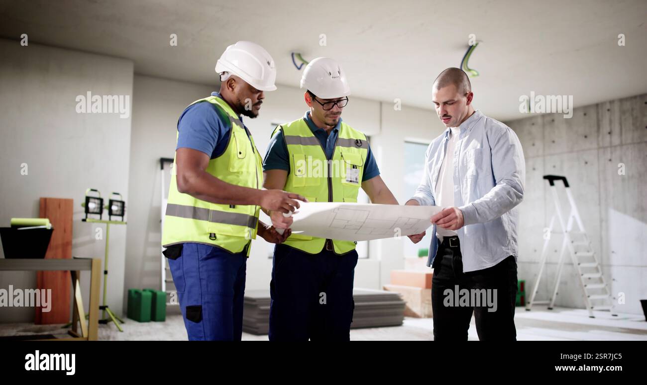 African American Builder and Hispanic Contractor Inspect House Interior ...