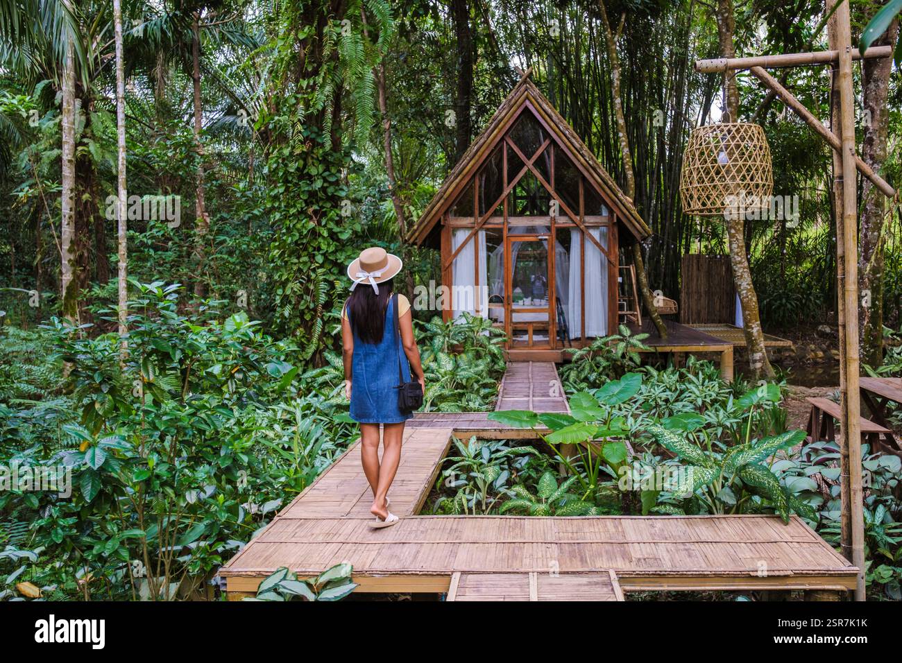 Embracing Natures Serenity A Traveler Strolls Towards A Charming