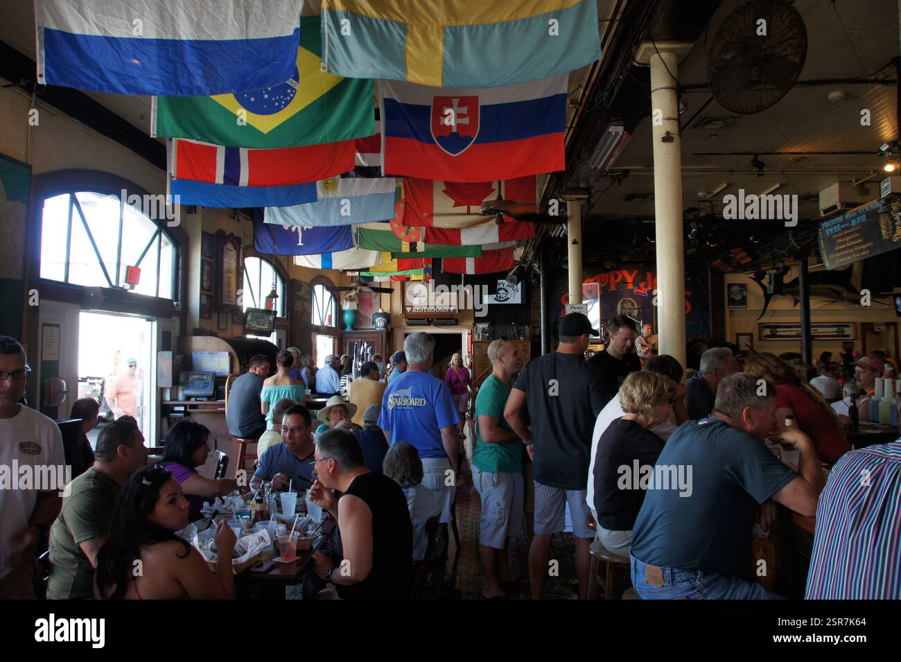 A vibrant Key West streetscape unfolds, showcasing a colorful array of ...