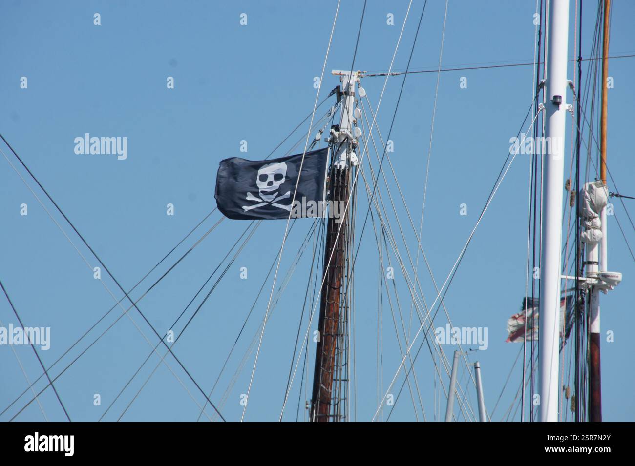 Jolly Roger flutters against a backdrop of rigging and masts. Key West ...