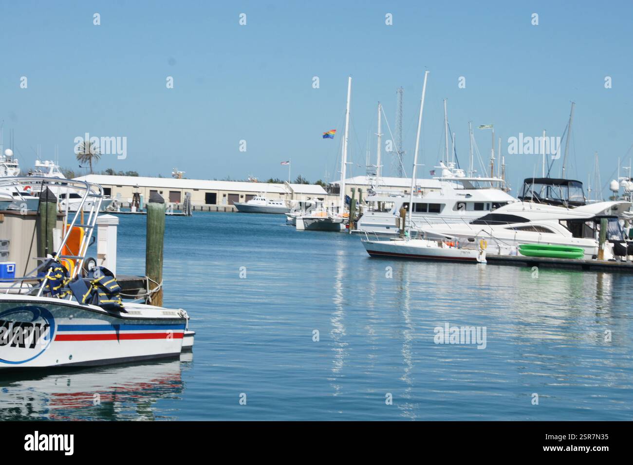 Key West Marina. Docked boats, clear blue water, sunny day. Peaceful ...